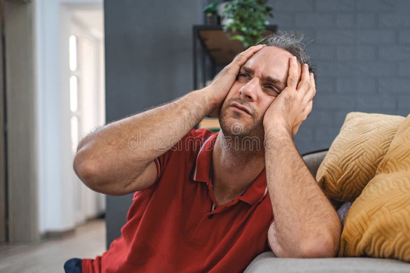 Man Sitting Alone at Home Looking Sad and Distraught Stock Photo ...