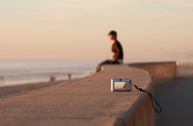 Man Sitting Alone Sunset Beach and Camera Stock Photo - Image of blur ...