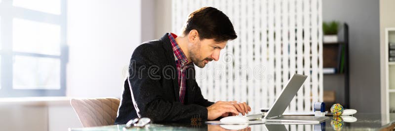 Man Sitting in Bad Posture Working on Computer Stock Photo - Image of ...