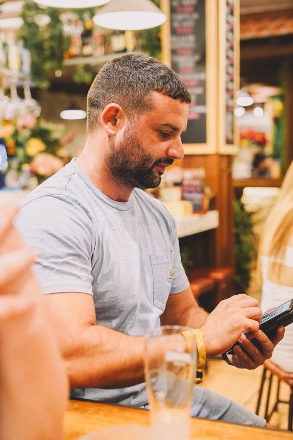 Man Sitting in a Bar Having a Good Time Stock Photo - Image of trendy ...