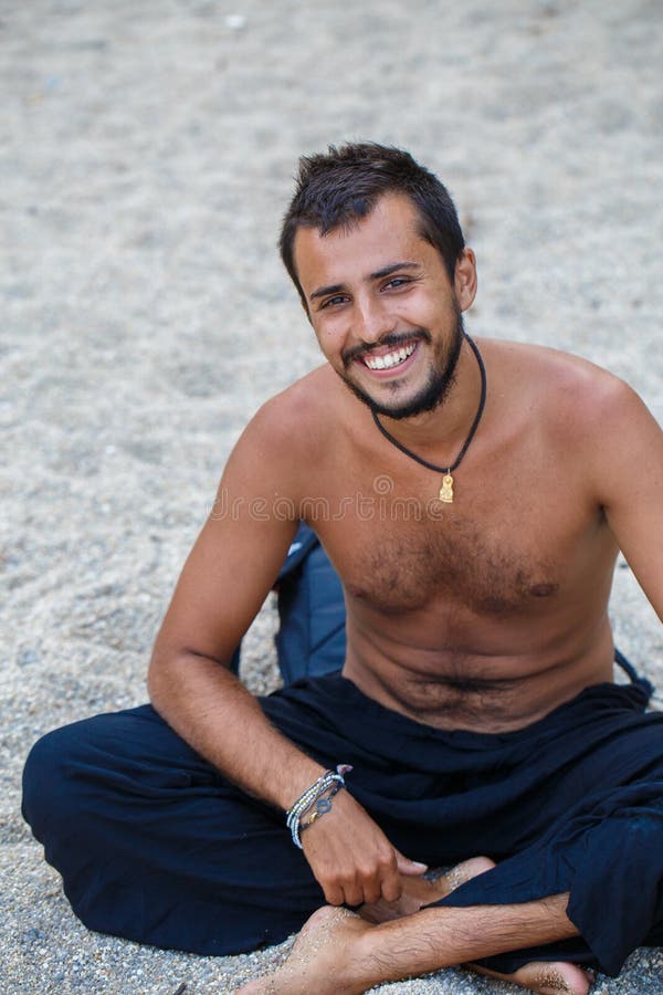 Man sitting on a beach stock image. Image of macho, beauty - 77939325