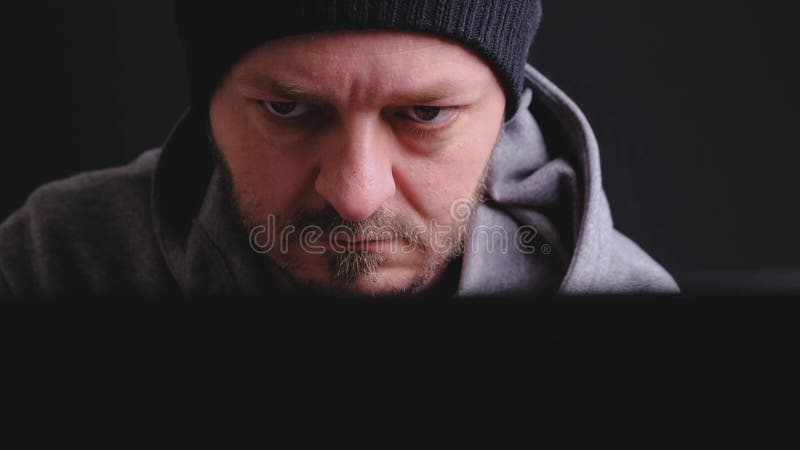 Man Sitting Behind the Computer Monitor Looking at Computer Screen ... Man Sitting Behind the Computer Monitor Looking at Computer Screen ...