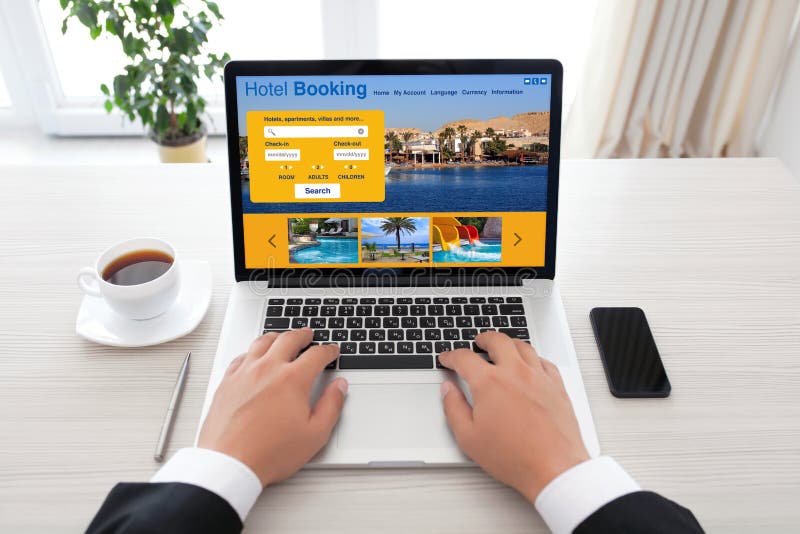Man Sitting with Laptop Computer with Hotel Booking on Screen Stock ...