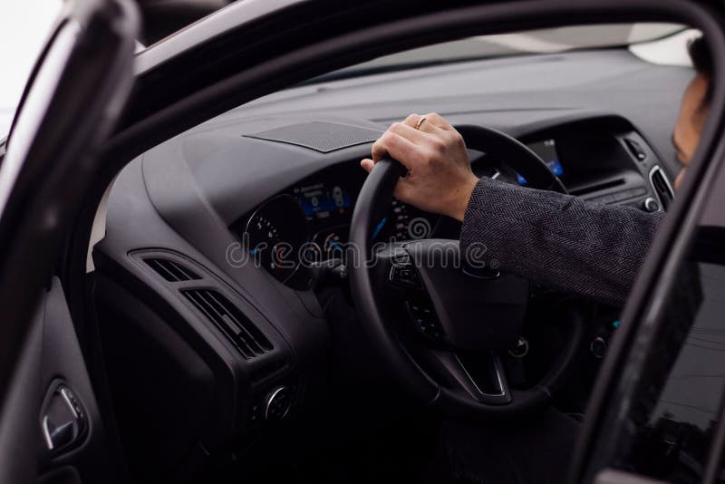 Man Sitting Behind the Wheel of a Car Close Up Stock Image - Image of ...