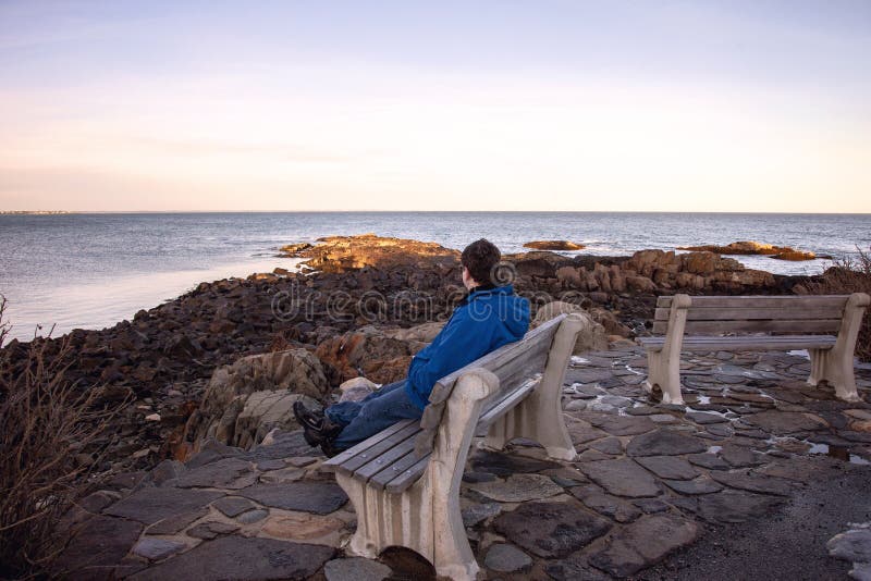 Man Sitting on a Bench on Marginal Way Path Along the Rocky Coast of ...