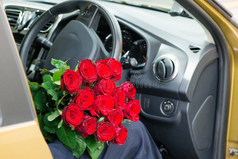 Man in car with roses stock photo. Image of celebration - 120723370
