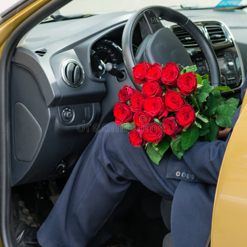 Man in car with roses stock image. Image of hand, beautiful - 120723411