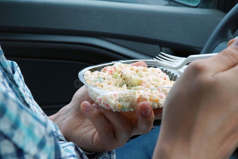 Man, Sitting in a Car, Eats a Salad with Mayonnaise from Plastic ...