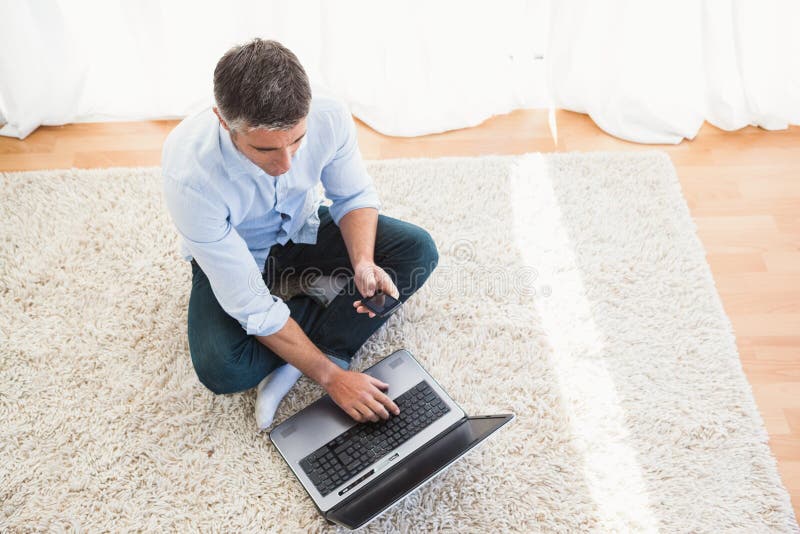 Man Sitting Carpet Stock Images - Download 2,751 Royalty Free Photos