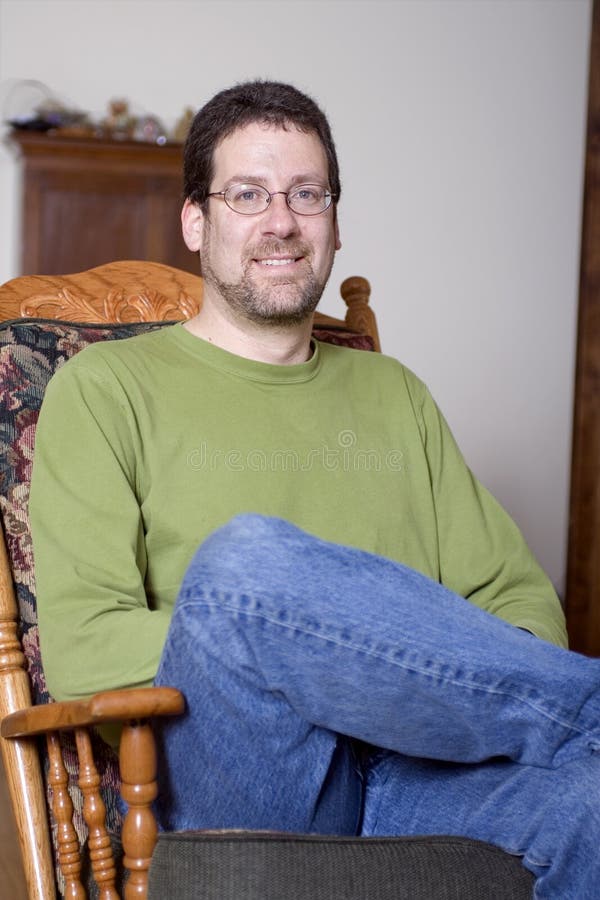 Man sitting in chair stock photo. Image of sitting, rocker - 2060312