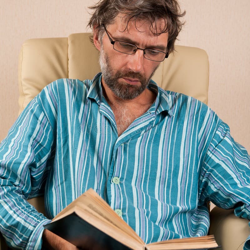 Man Sitting In Chair Reading Book Stock Image Image Of Interior