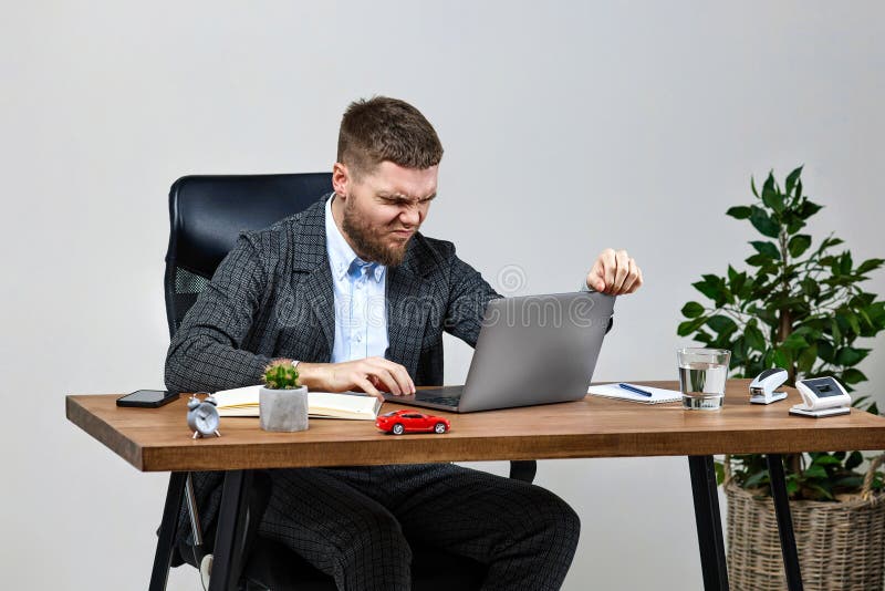 Man Sitting on Chair at Table and Resting, Using Laptop Stock Image ...