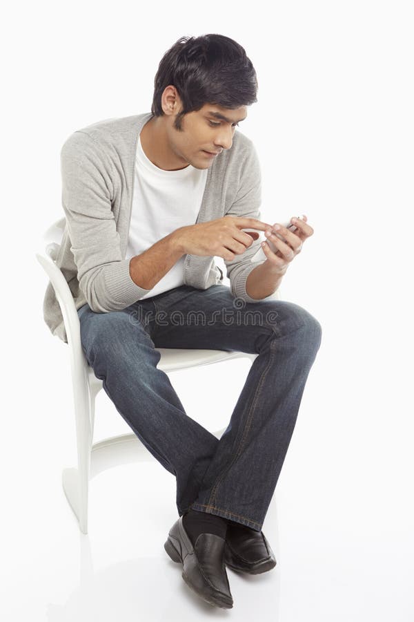 Man Sitting on a Chair, Text Messaging Stock Image - Image of holding ...