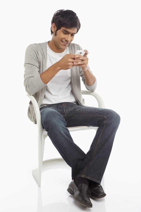 Man Sitting on a Chair, Text Messaging Stock Image - Image of pakistani ...