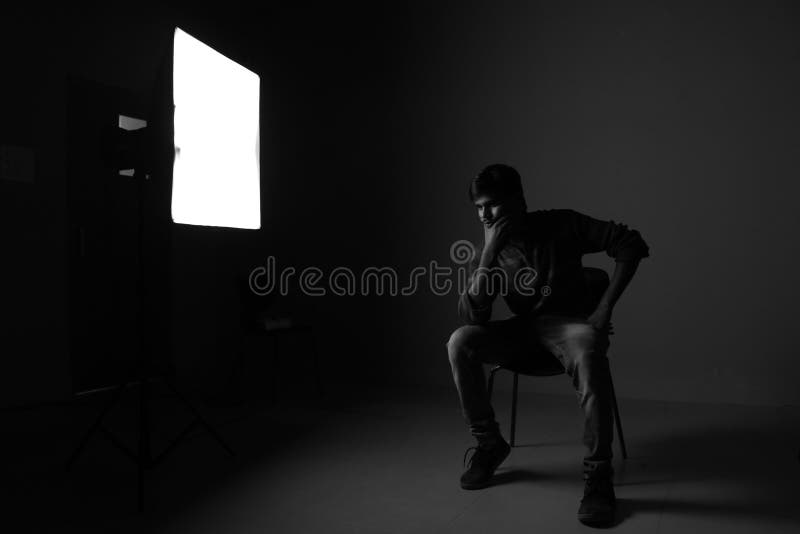 Man Sitting On Chair While Thinking Picture. Image: 117989128