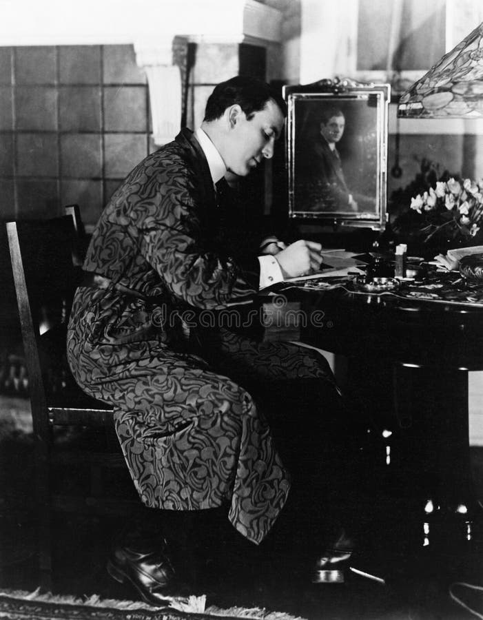 Man in a Robe Sitting on a Chair Stock Photo - Image of inside, bygone ...