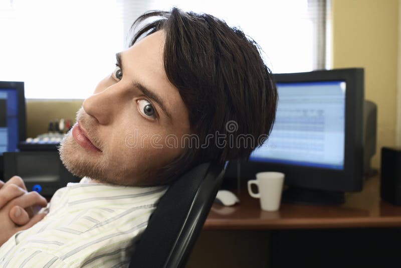 Man Sitting by Computer Desk Stock Image - Image of broadband, away ...