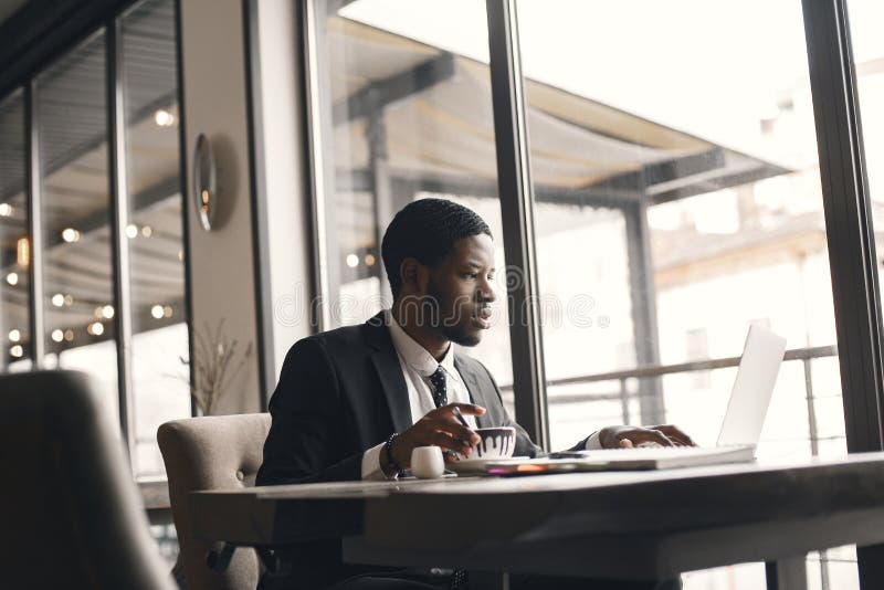 Man Sitting at the Computer and Drinking Coffee Stock Image - Image of ...