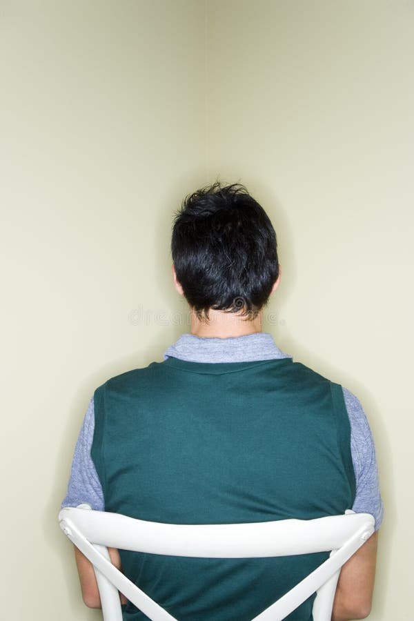 Man Sitting In Corner Stock Photo - Image: 5621760