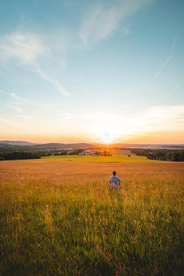 Man Sitting in a Cornfield Thinks about His Future Looking into the ...