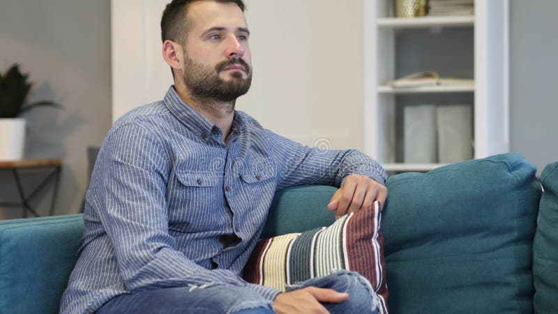 Man Sitting on Couch in Bedroom Stock Photo - Image of businessman ...