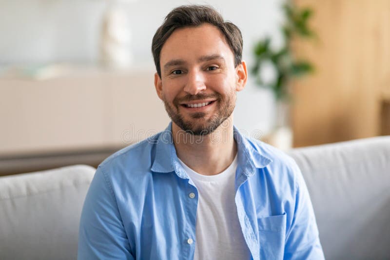 Man Sitting on Couch Smiling, Home Interior Stock Photo - Image of ...