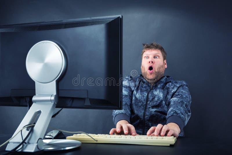 Man Sitting at Desk Looking on Computer Screen Stock Image - Image of ...