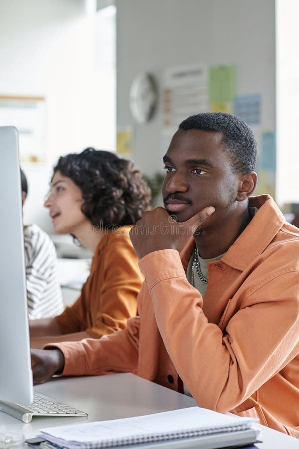 Contemplating Work at Computer in Office Setting Stock Photo - Image of ...