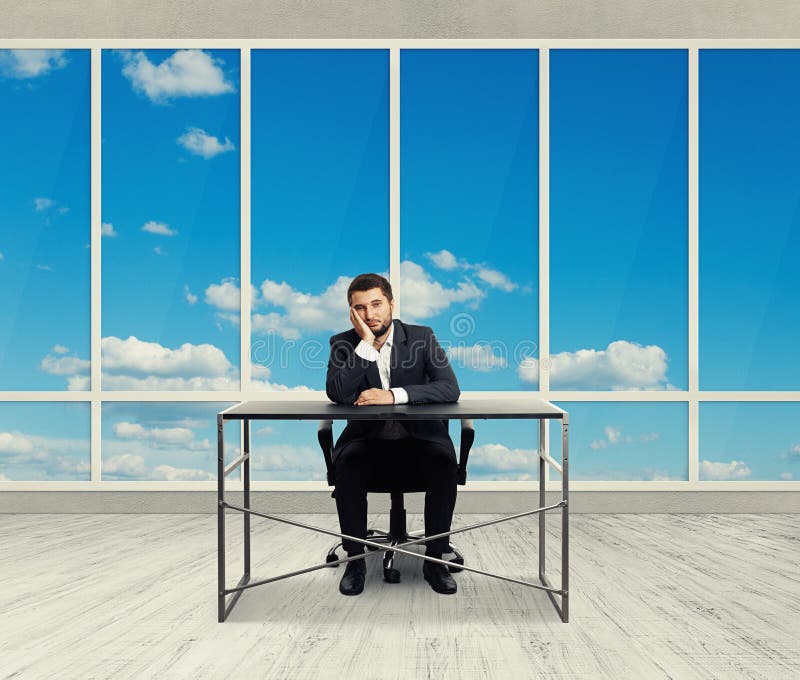 Man Sitting in the Empty Office Stock Photo - Image of table, room ...