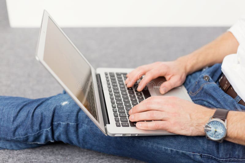 Man Sitting on Floor and Tying on Computer S Keyboard Stock Photo ...