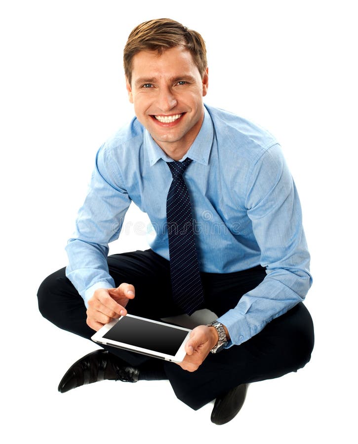 Man Sitting on Floor Using Touch Screen Device Stock Photo - Image of ...