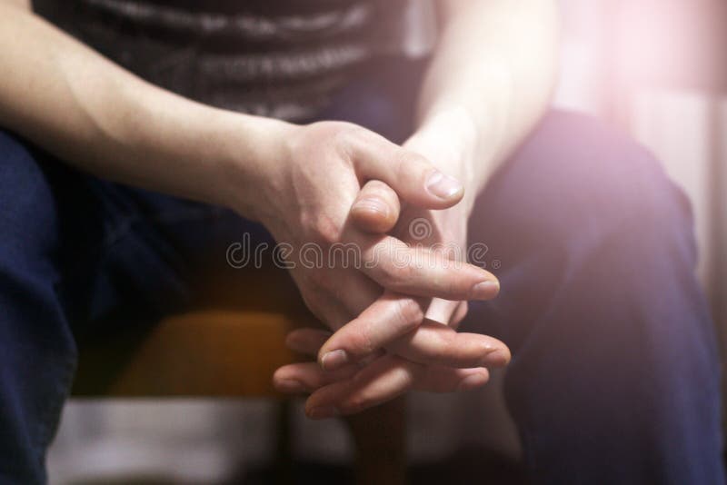 Man Sitting with Folded Hands Stock Photo - Image of generation, folded ...