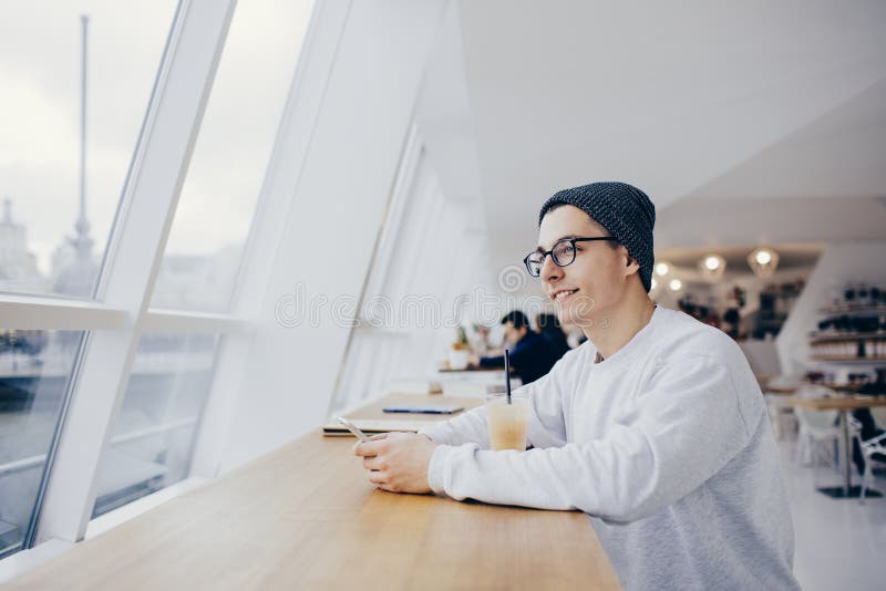 Man is Sitting in Front of the Table Near Window Stock Image - Image of ...