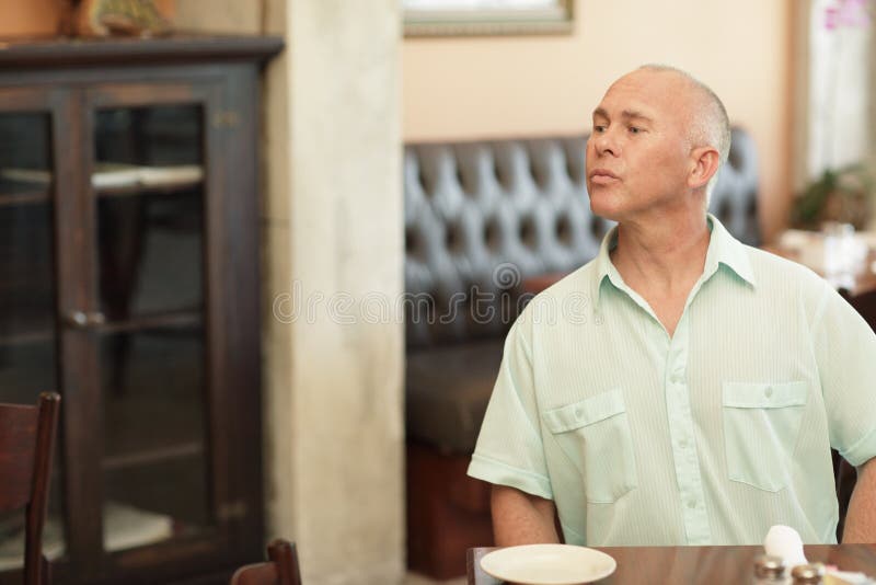 Man sitting and glancing stock photo. Image of adult - 15904288