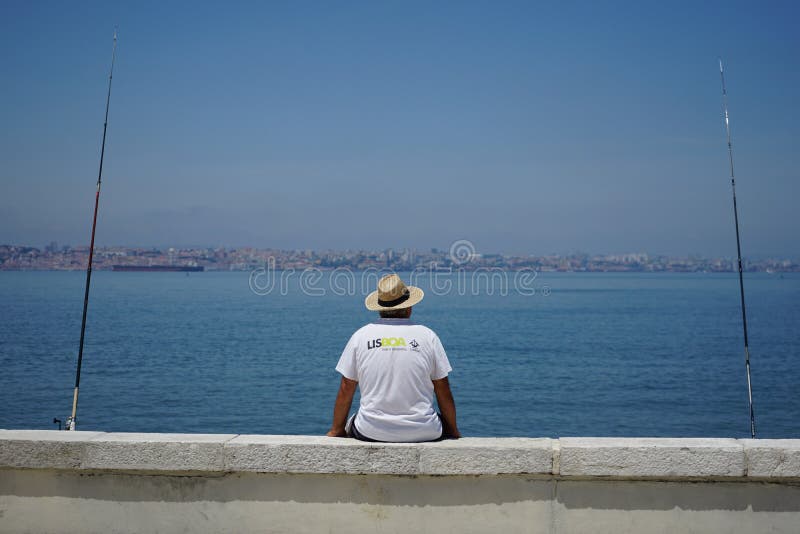 Man Sitting on His Back Watching the River and the City of Lisbon ...