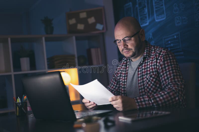 Man Doing Paperwork Late at Night Stock Image - Image of business ...