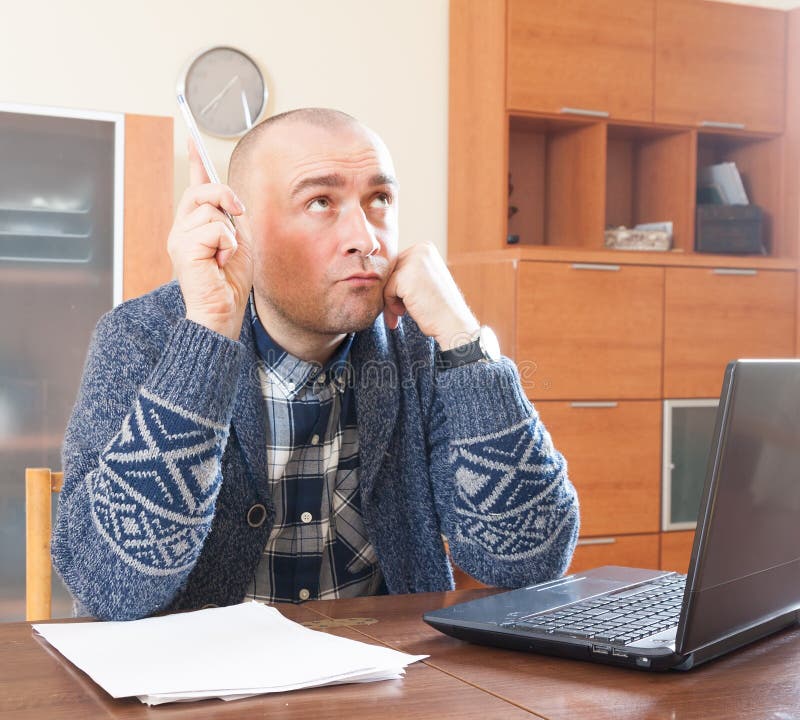Man sitting at his laptop stock photo. Image of communication - 42573020