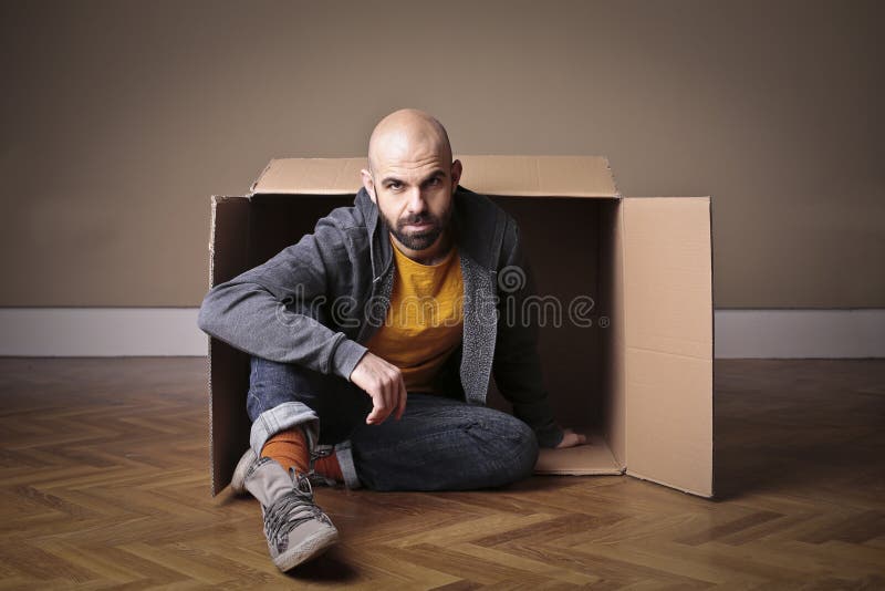 Man inside a cardboard box stock photo. Image of interior - 67491584