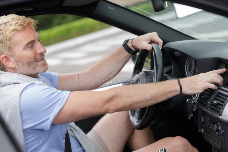 Man Sitting Inside Vehicle in Car Dealership Stock Image - Image of ...