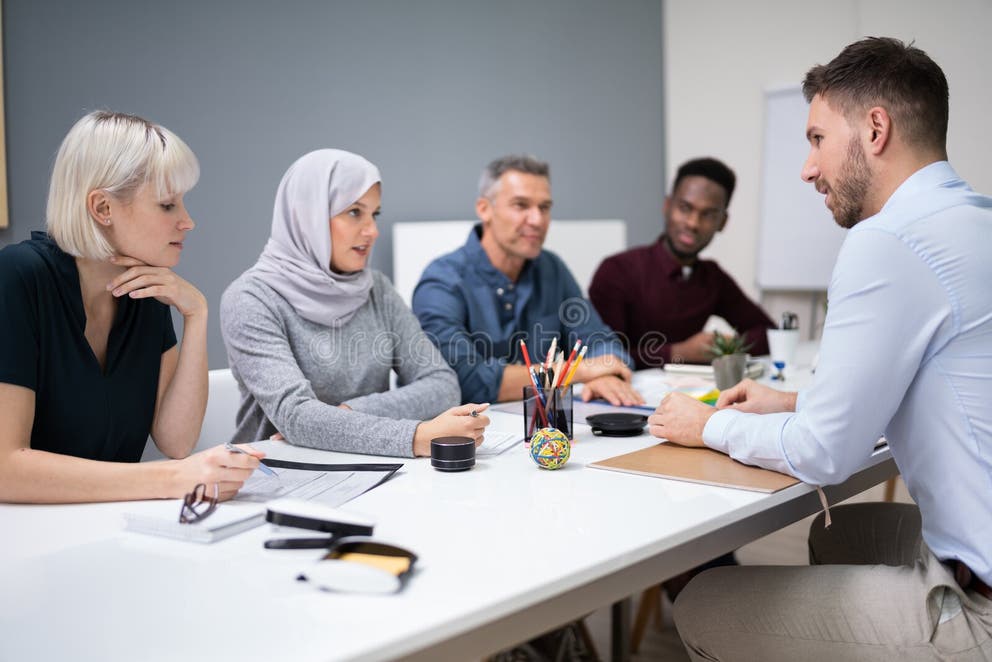 Man Sitting at Interview stock photo. Image of office - 211147006