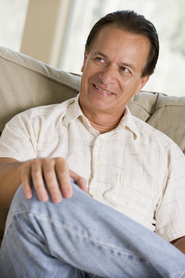 Man Sitting in Living Room Smiling Stock Image - Image of relaxed ...