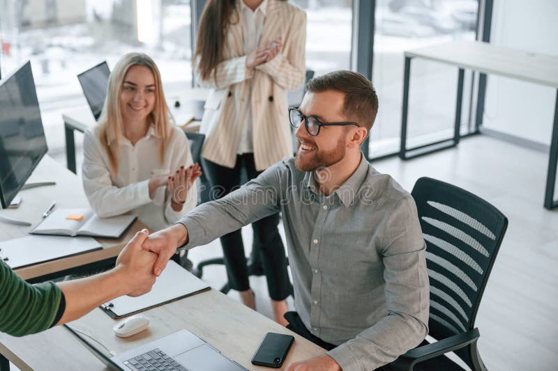 Man is Sitting and Making Handshake with Woman. Successful Team are ...