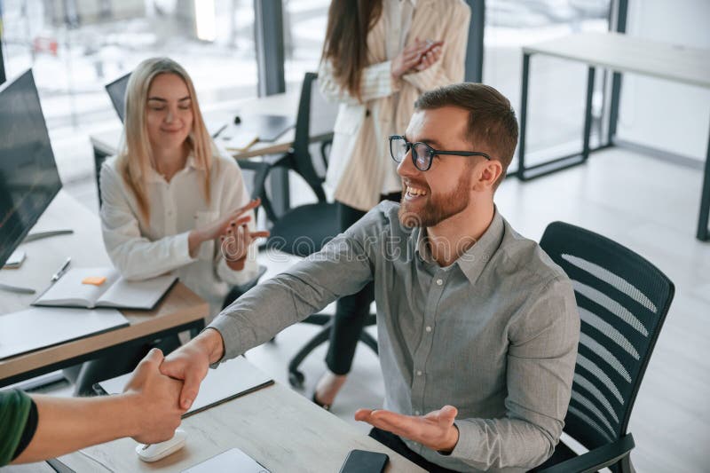 Man is Sitting and Making Handshake with Woman. Successful Team are ...