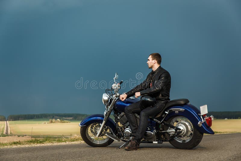Man sitting on motorcycle stock photo. Image of biker - 58924422