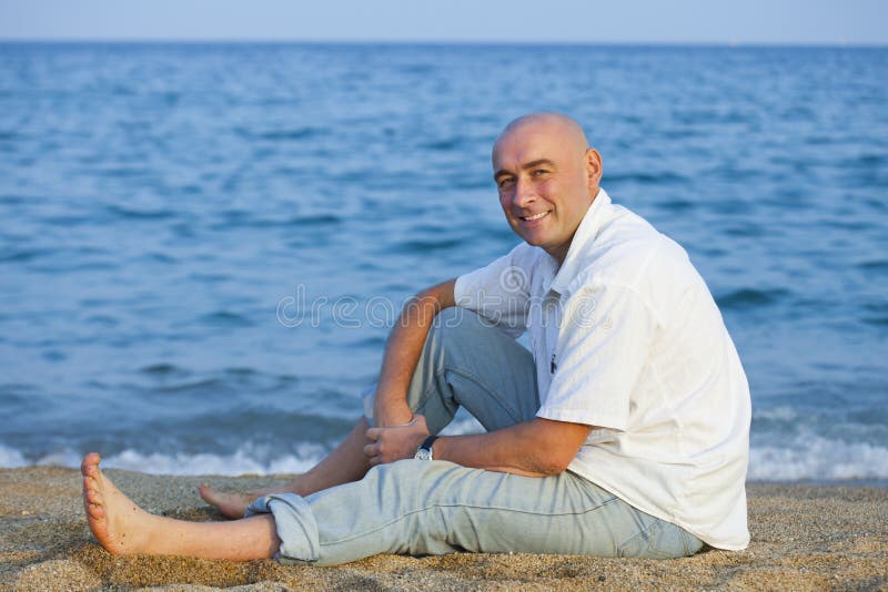 Man sitting near sea. stock photo. Image of lonely, portrait - 48087238