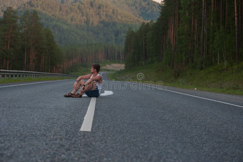 Man sitting on the road stock image. Image of lifestyle - 97041965