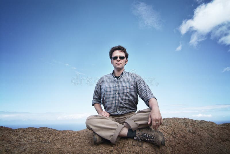 Man is sitting on a rock stock image. Image of looking - 30825095