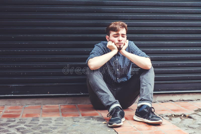 Man sitting sad alone stock photo. Image of shock, embarrassment ...