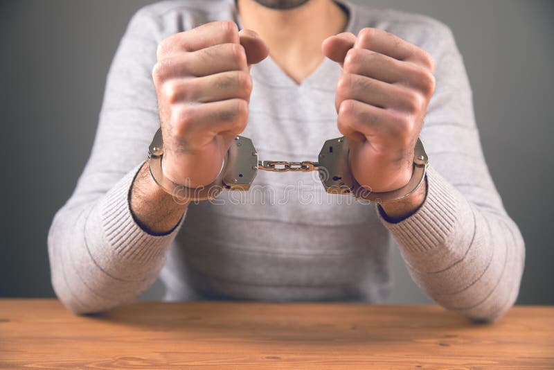 Man sitting in shackles stock image. Image of punishment - 216014477