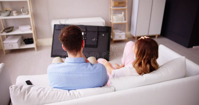 Man Sitting on Sofa in Front Fallen Television Stock Image - Image of damage, broken: 273645649